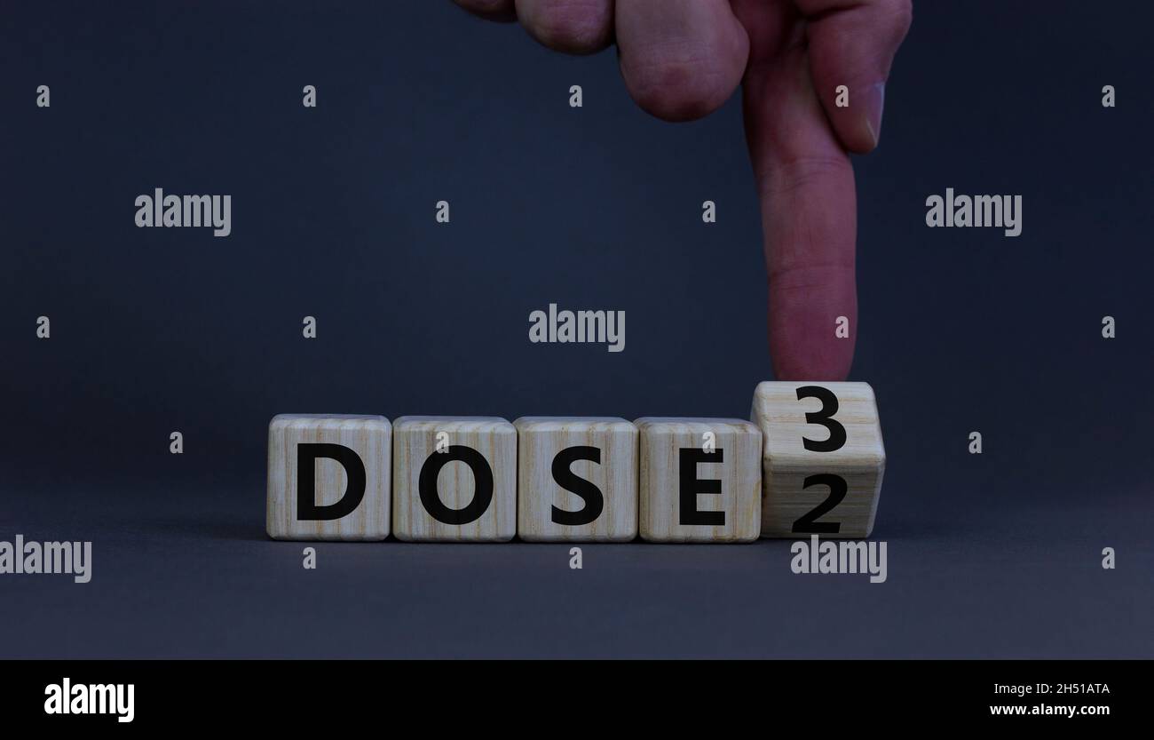 Covid-19 booster dose vaccine shot symbol. Doctor turns cubes and ...