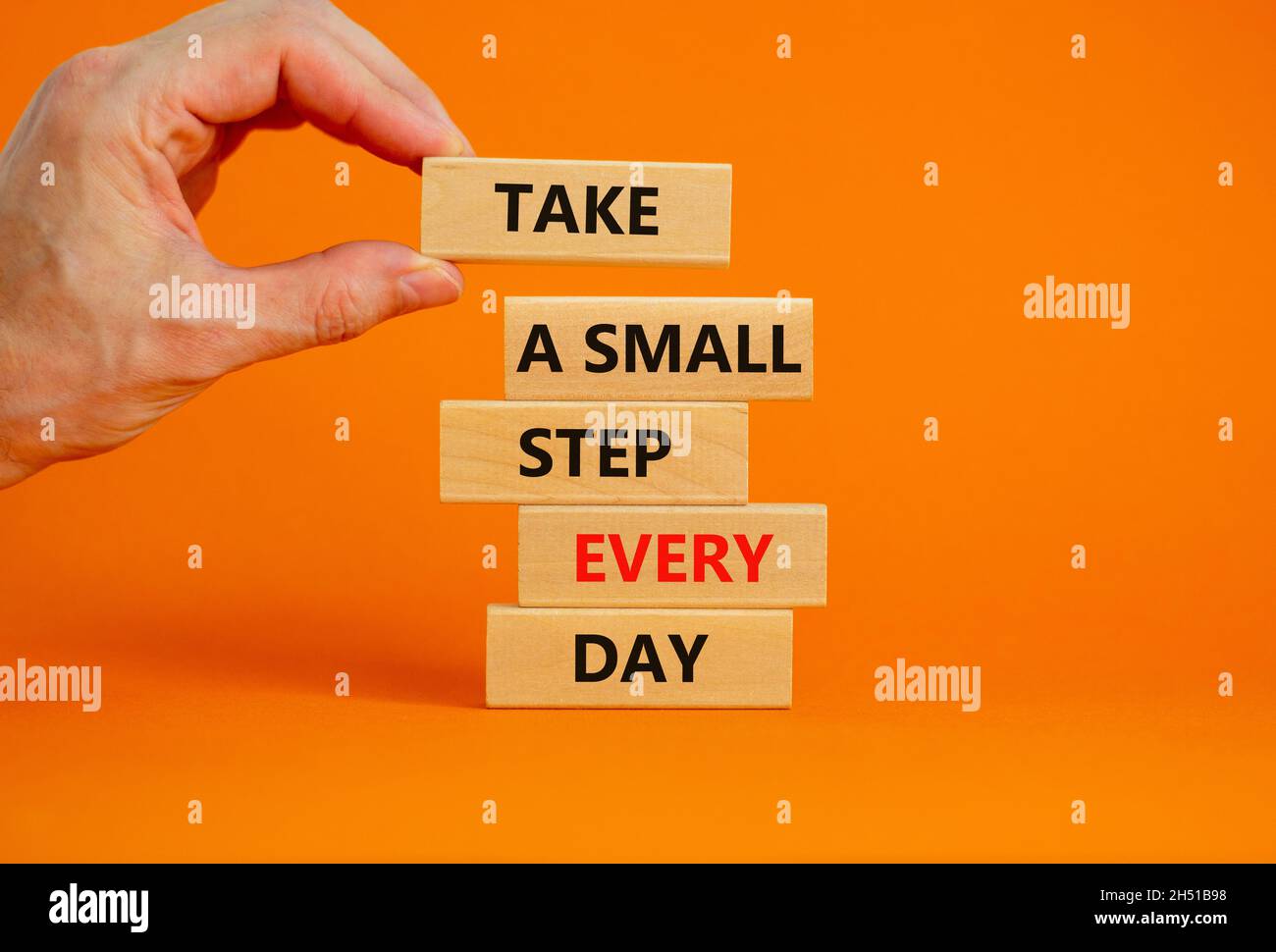 Take a small step every day symbol. Wooden blocks with words Take a ...