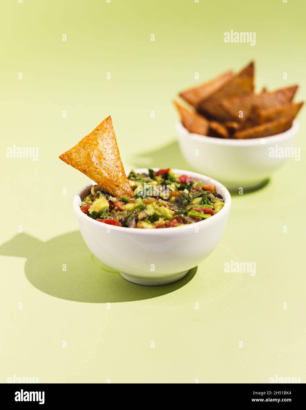 Guacamole is a dish of mashed avocado mixed with chopped onion ...