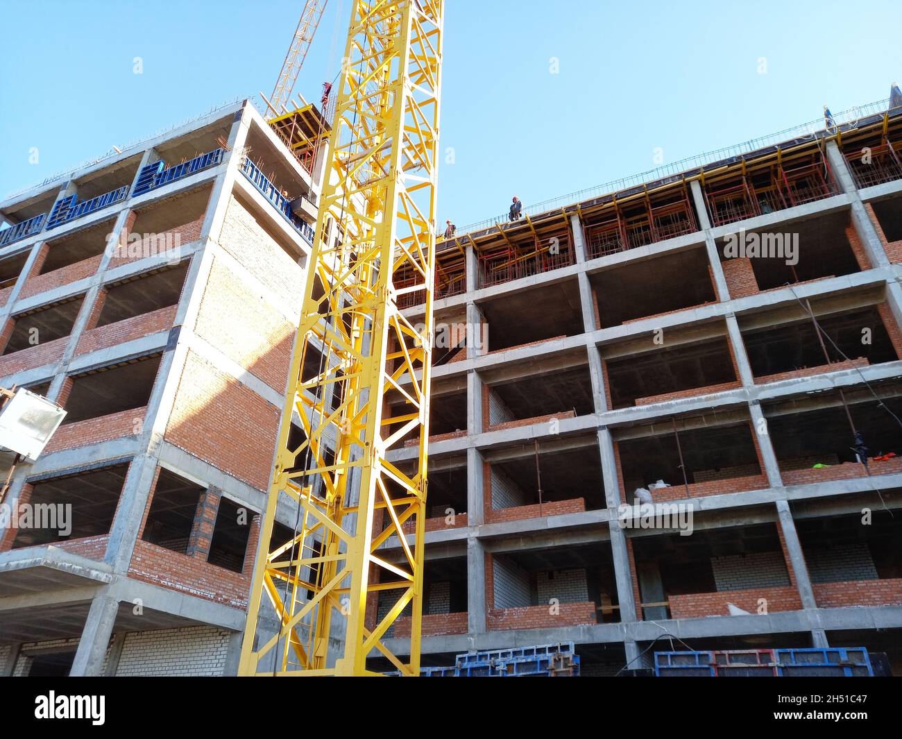 Construction of a large building. Tower crane at a construction site ...