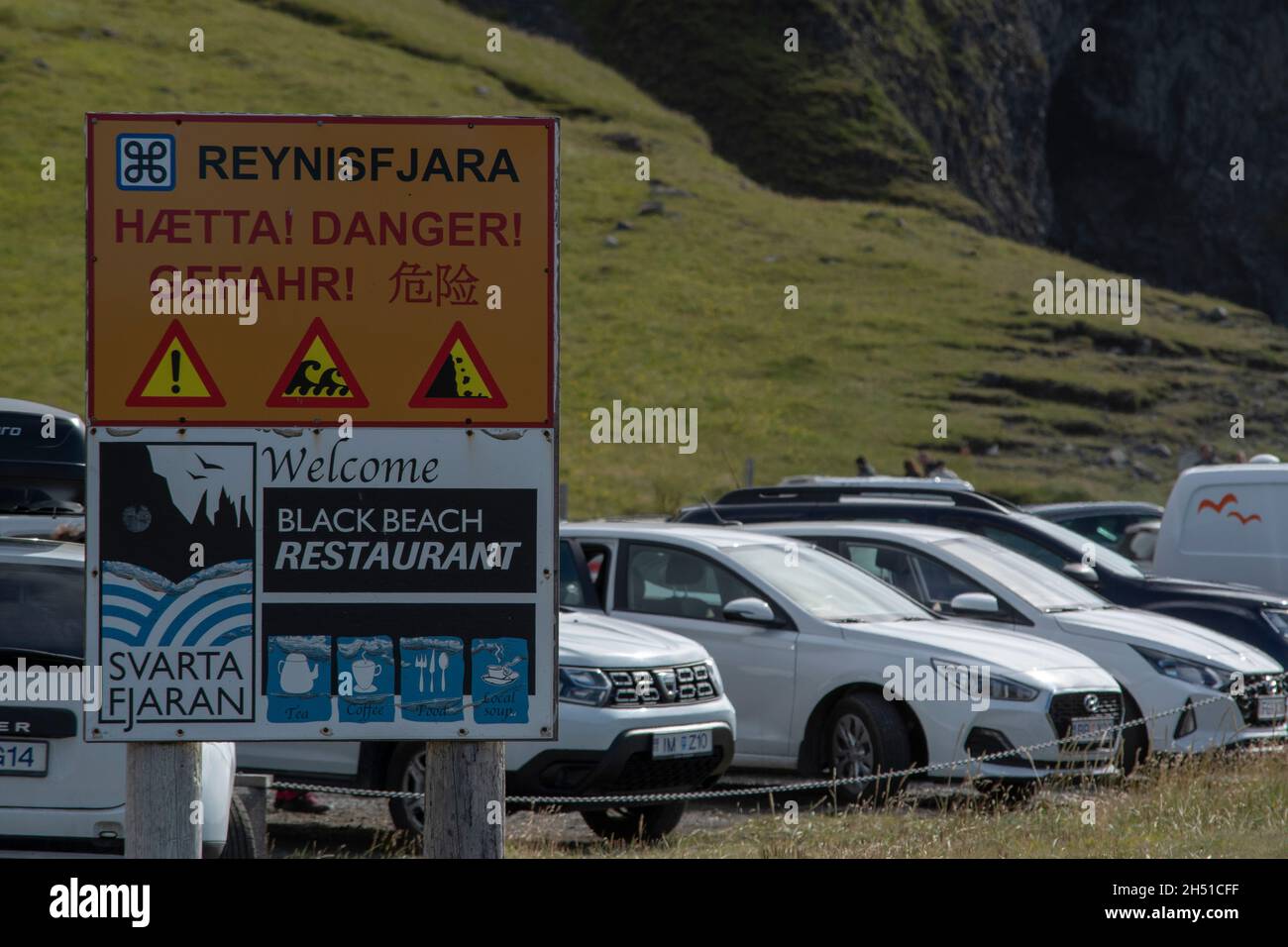 Landscape of entrance warning sign at Reynisfjara Black sand Beach Vik ...