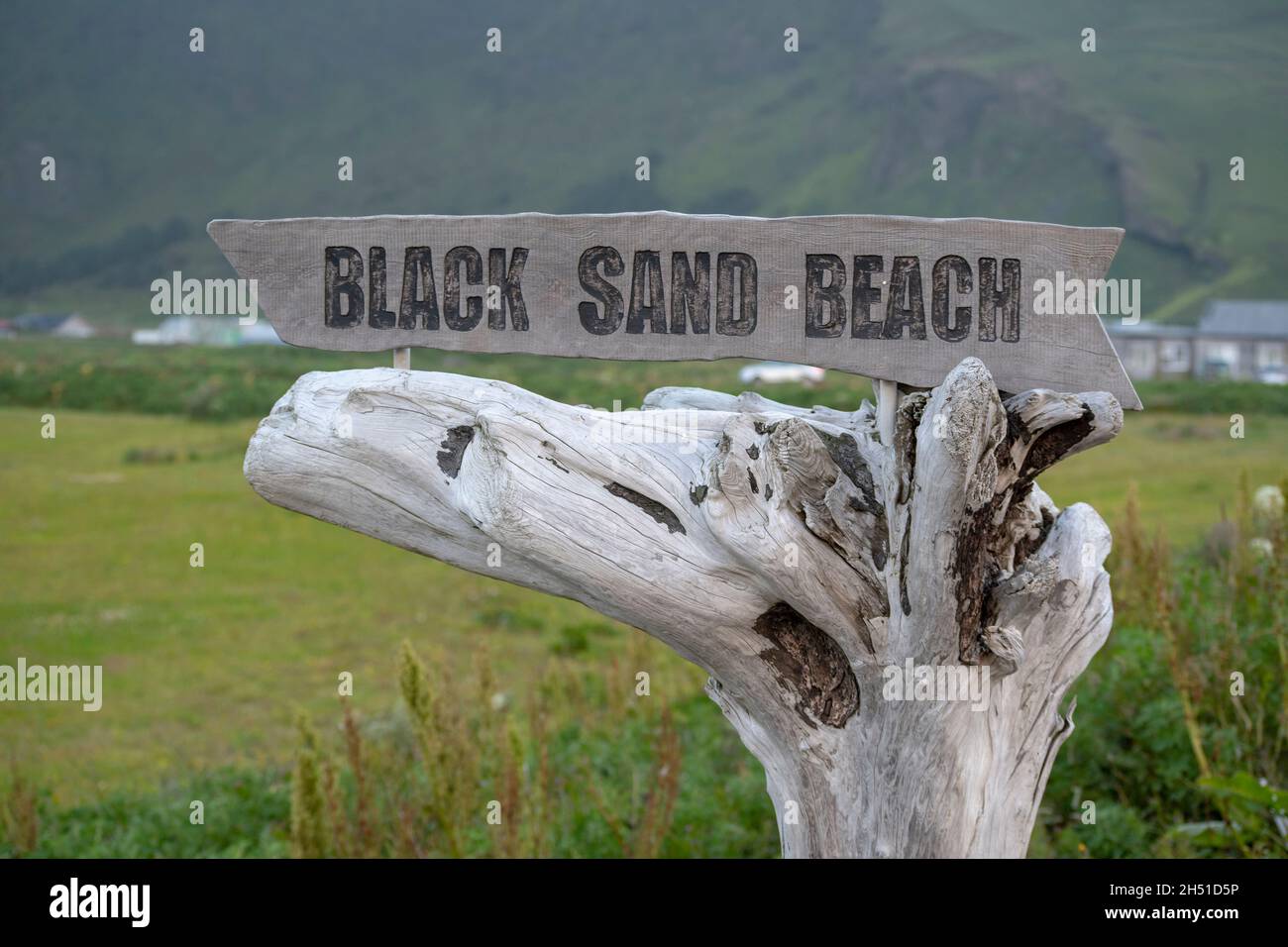 Landscape of Black Sand Beach entrance sign in Vik Stock Photo - Alamy