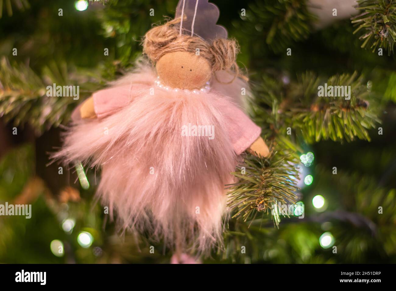 Closeup of a little angel doll on the Christmas tree Stock Photo - Alamy