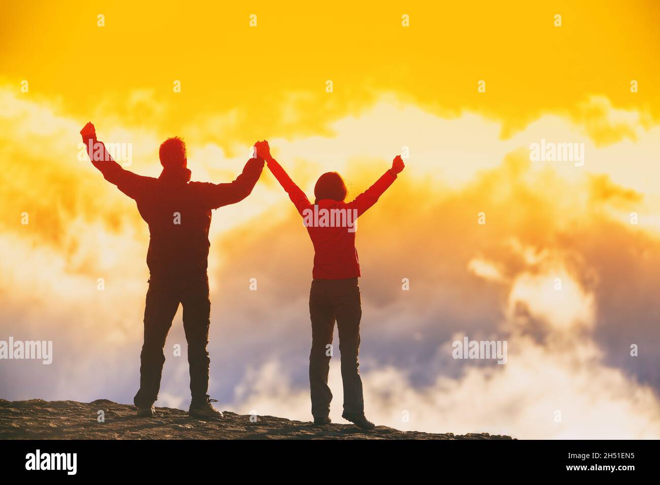 Success people reaching goal achievement - winning couple hikers with ...