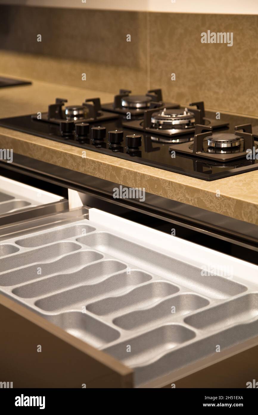 Interior of luxurious modern kitchen equipment and black glass ceramic ...