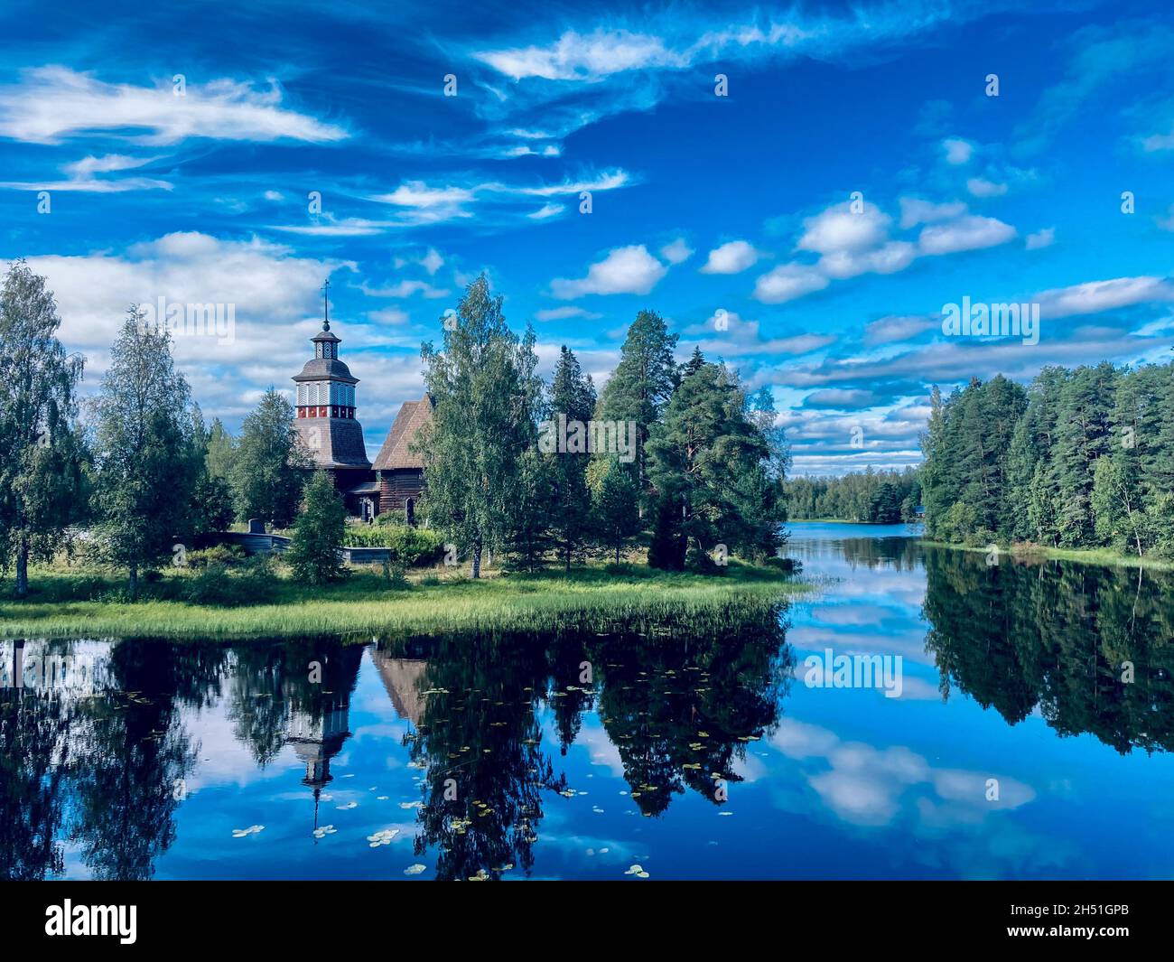 landscape in finland with trees, lake and clouds Stock Photo - Alamy