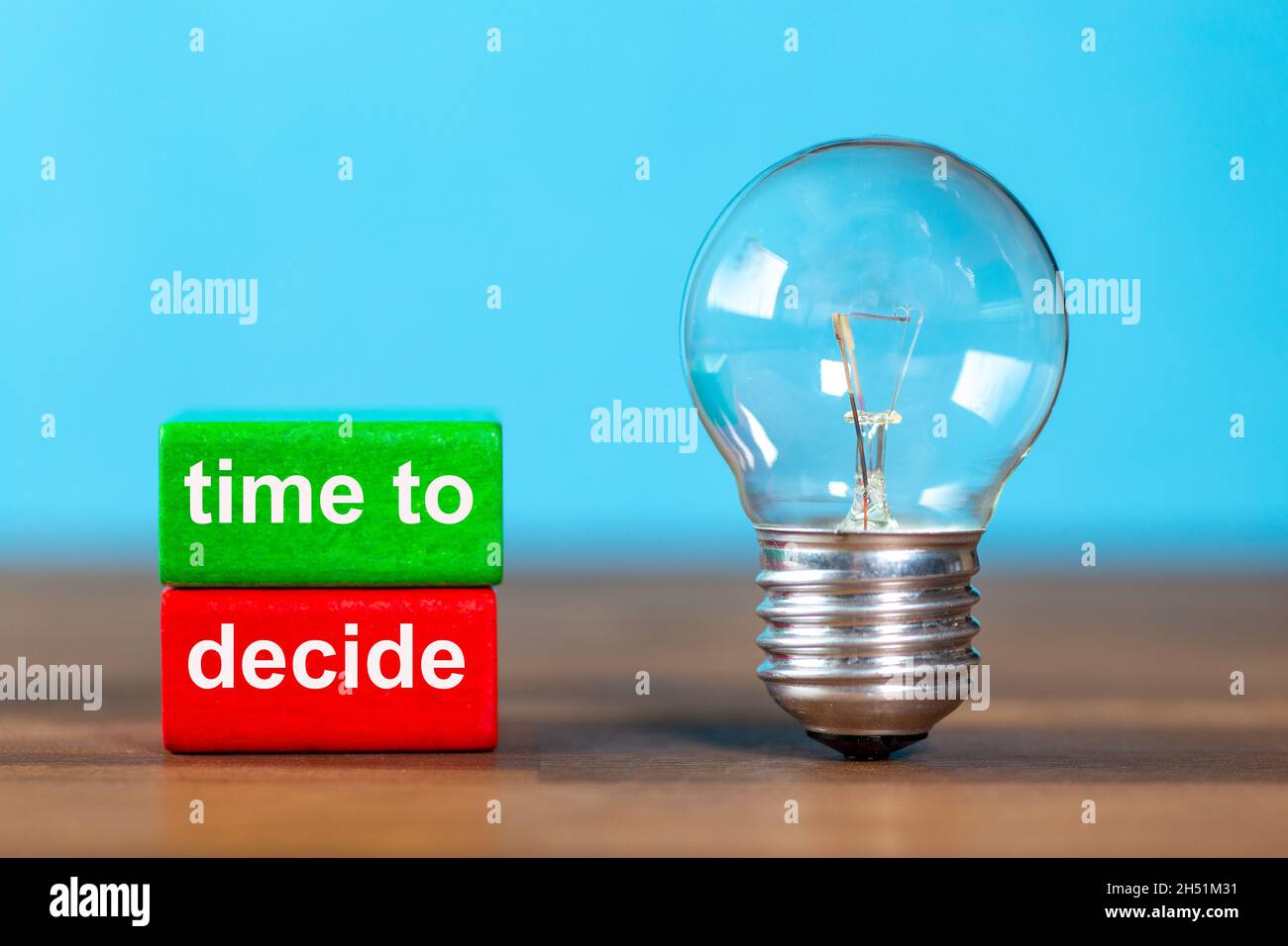 time to decide are the word written on a red and a green toy block ...