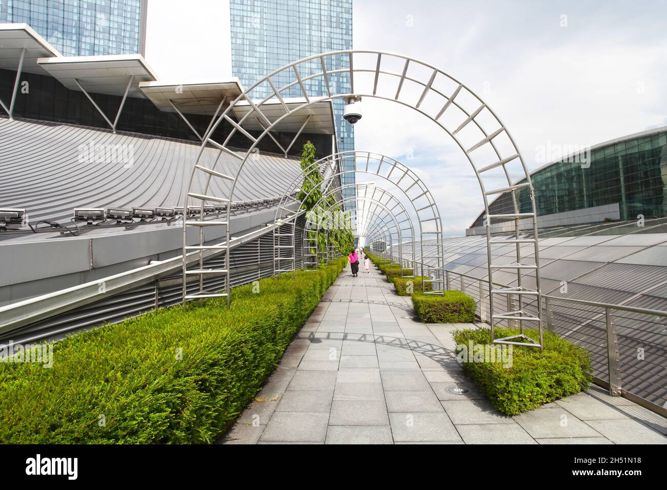 A pathway leading up to the side of the Marina Bay Sands Hotel located ...