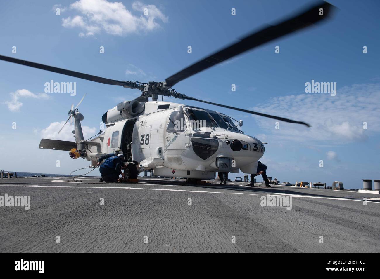 21108-N-TC847-1603 SOUTH CHINA SEA (Oct. 28, 2021) Sailors chock and ...