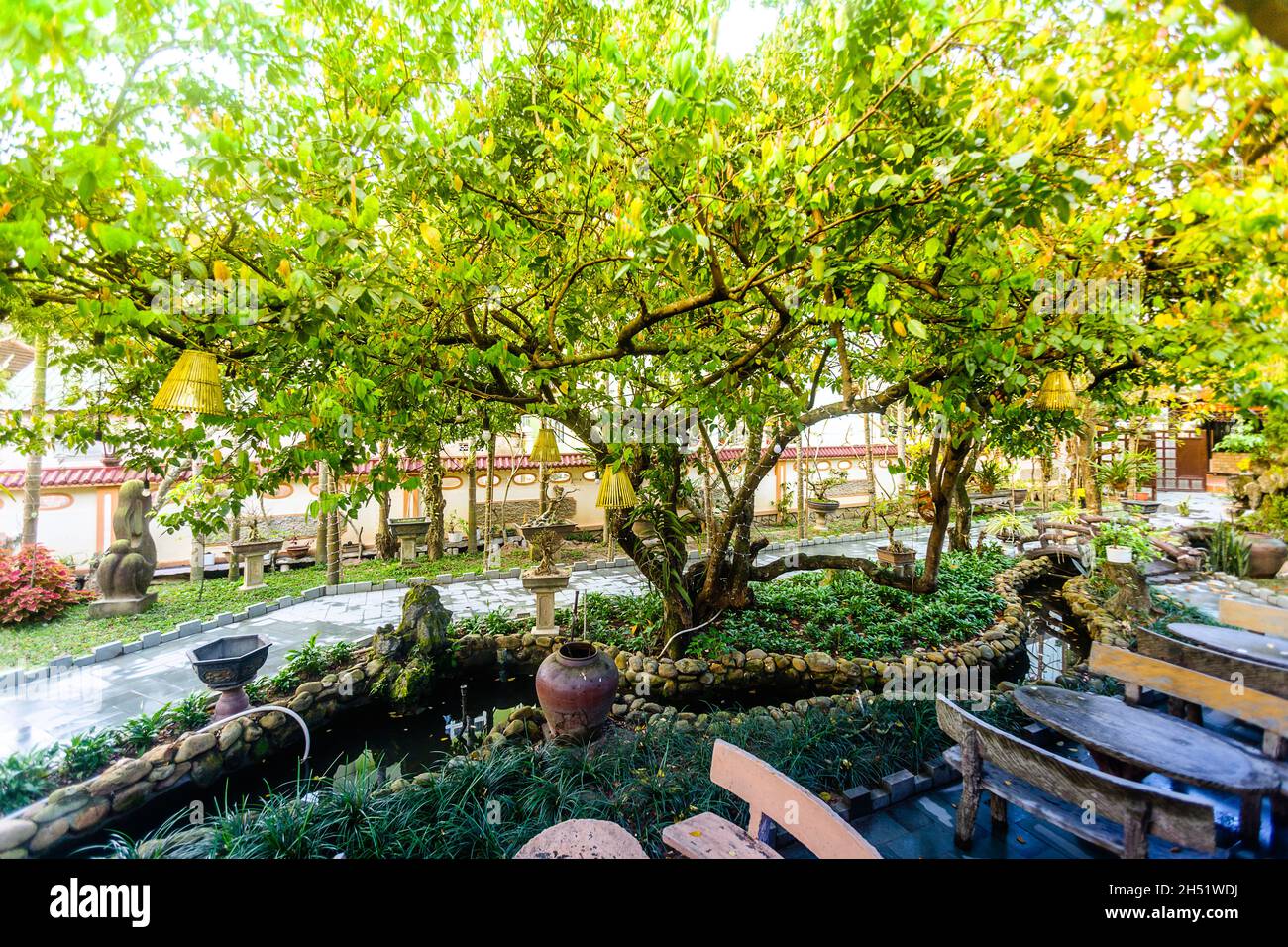 A small eating area in the beautiful landscaping of this cafe in HUE ...