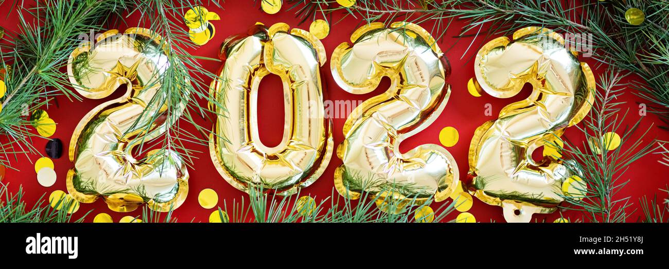 Happy new year 2022 background. Metallic balloons golden color on red ...