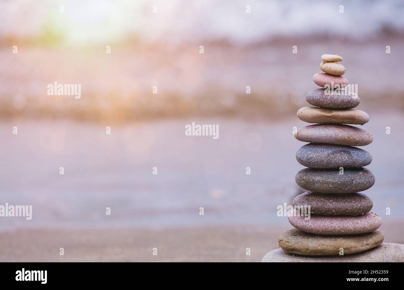 Rock balancing or stone stacking, rock stone or sea pebbles pile or ...