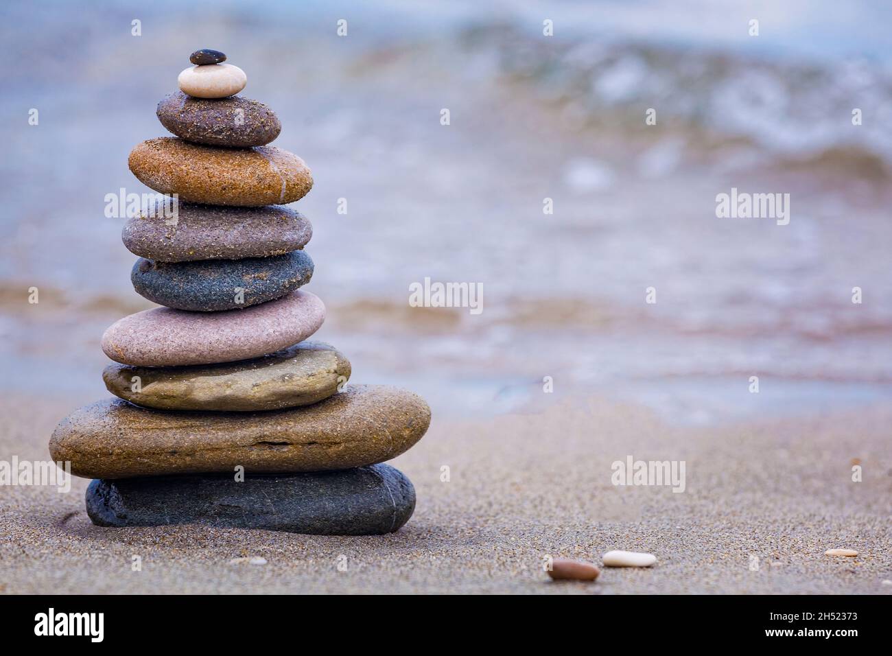 Rock balancing or stone stacking, rock stone or sea pebbles pile or ...