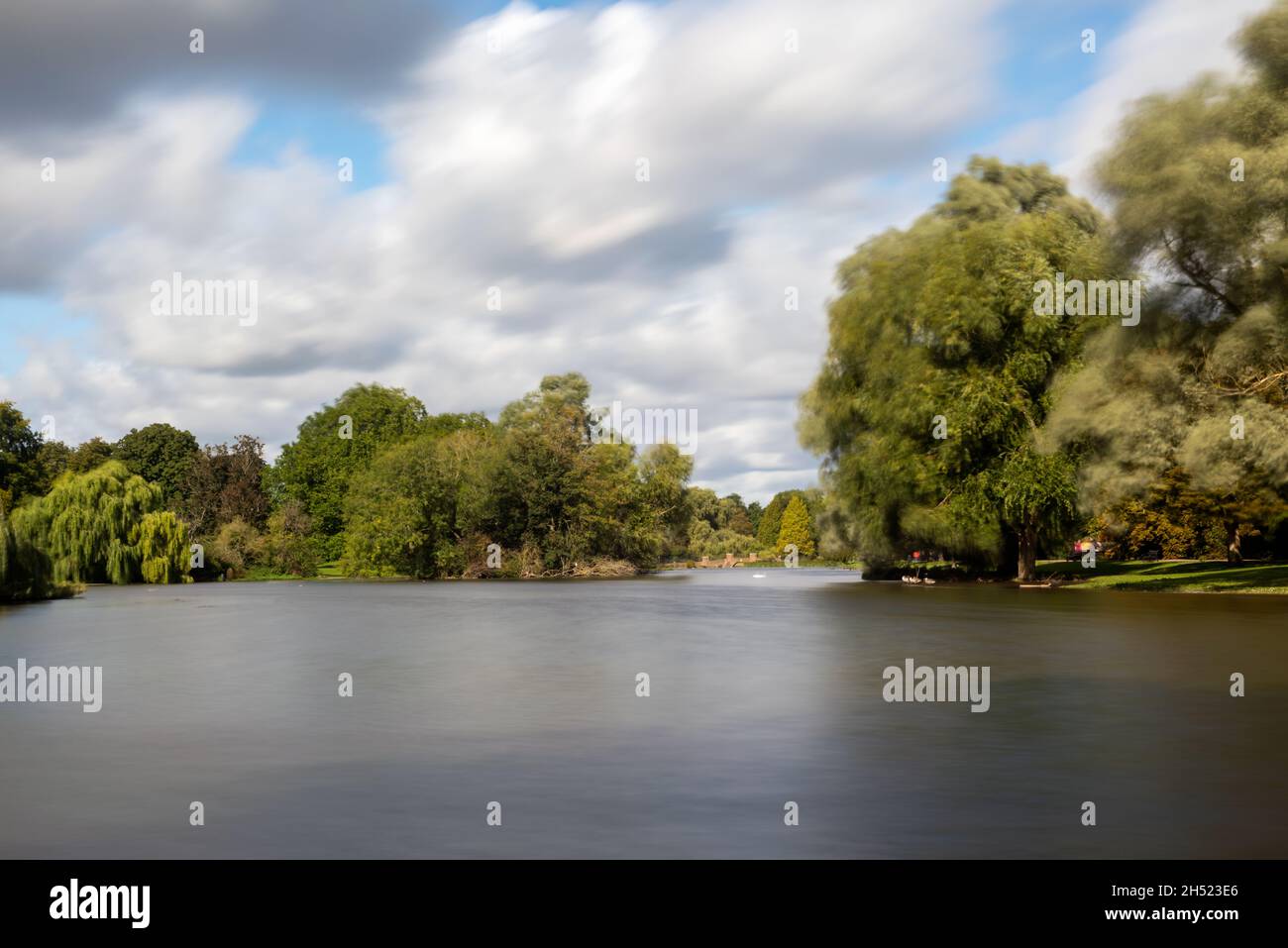 Beautiful lake landscape of water surrounded by trees Stock Photo - Alamy