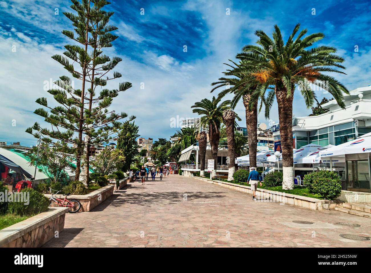 Saranda, Albania - September 2016: Palm trees, tourists on the ...