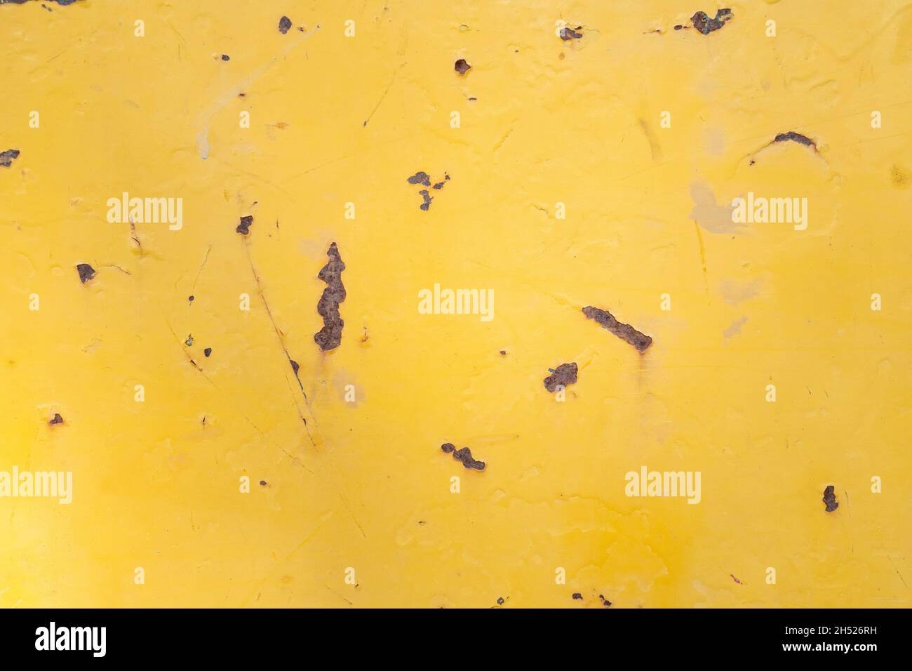 Yellow painted metal with rust and distress Stock Photo - Alamy