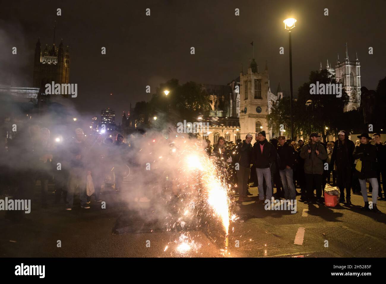 London, UK. 05th Nov, 2021. Light flares are lit on the road during the ...