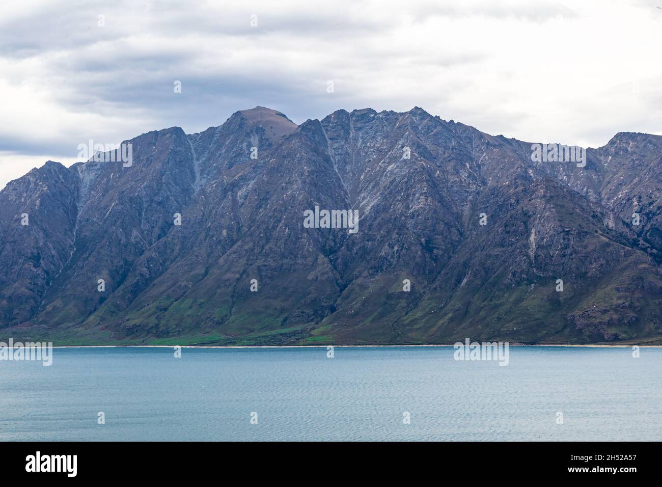 Sheer cliffs by the lake. New Zealand Stock Photo - Alamy