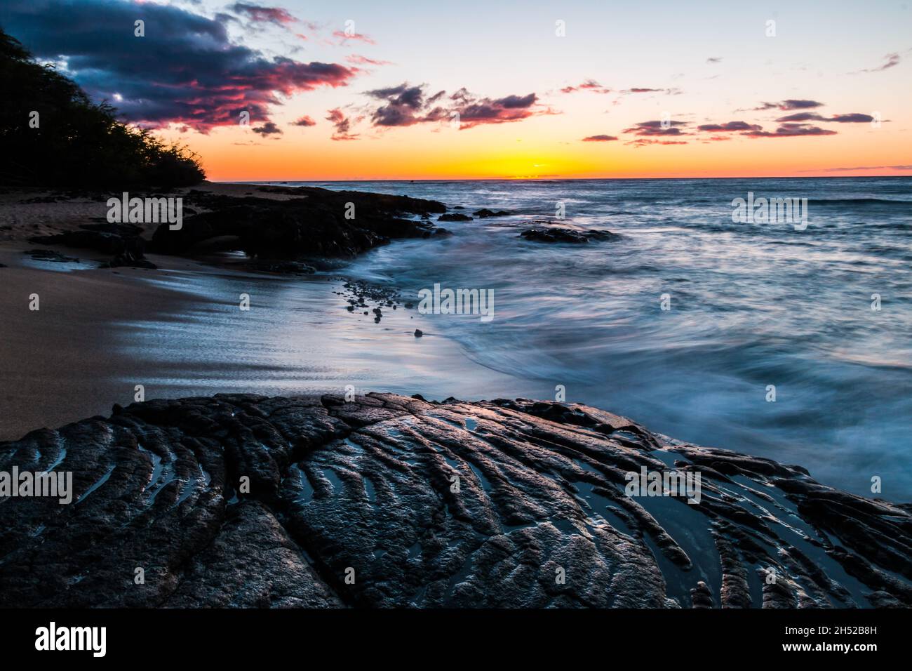 Waves Washing Over Ancient Lava Flows on Kapalaoa Beach at Sunset ...