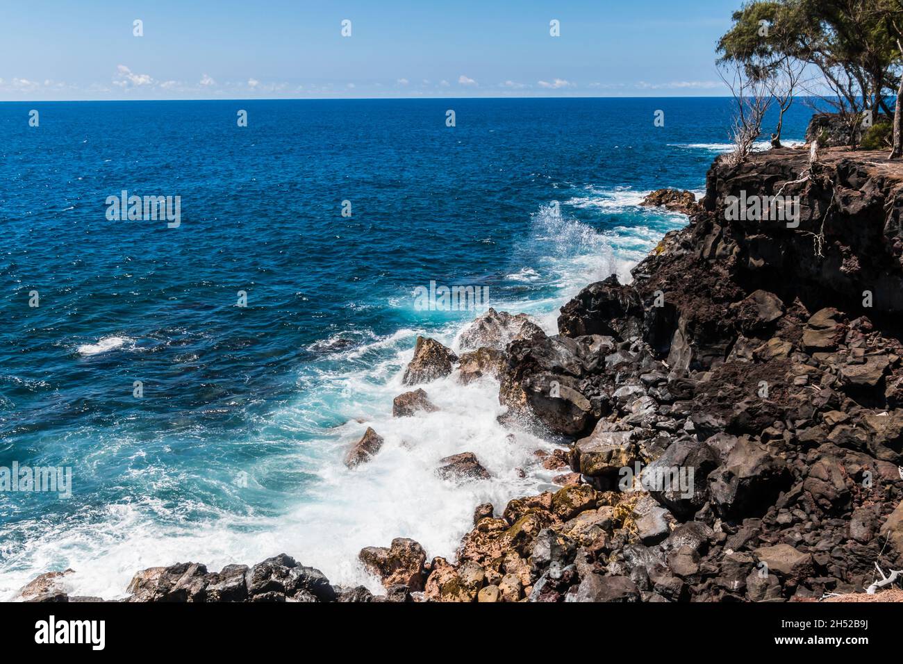Waves Crashing Against The Rugged Volcanic Sea Cliffs of MacKenzie ...