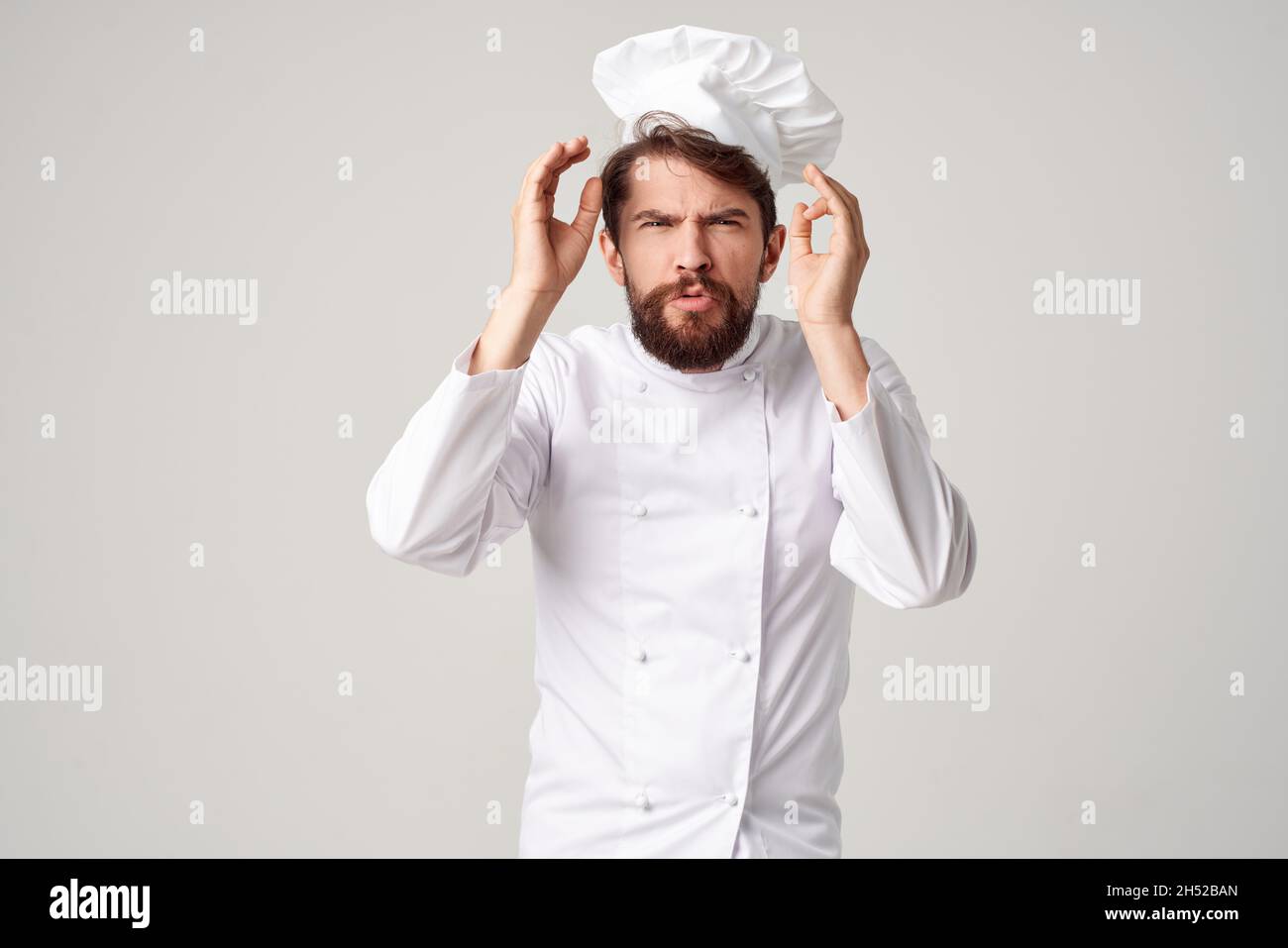 male cook kitchen Job hand gestures light background Stock Photo - Alamy
