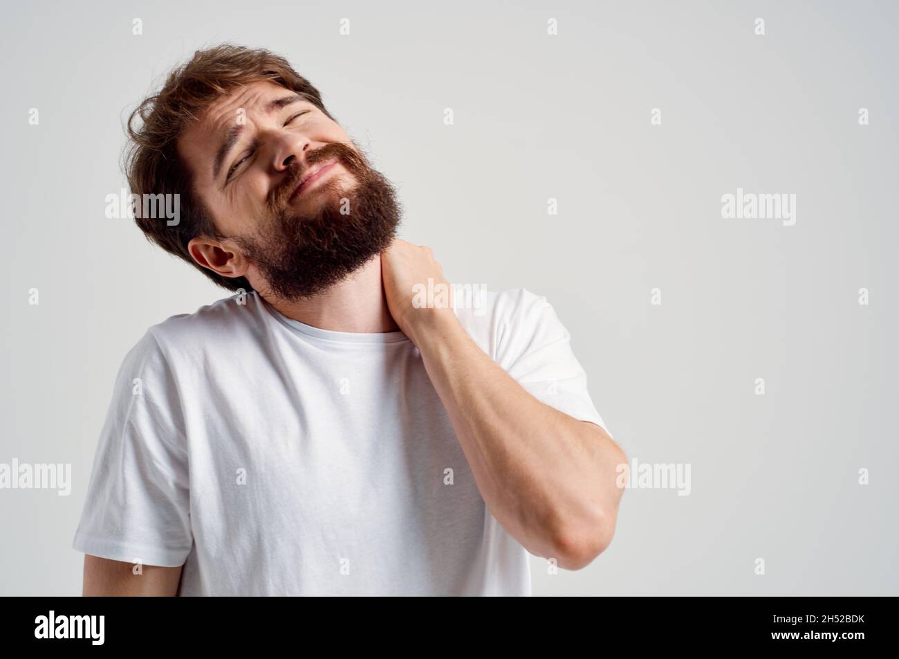 emotional man holding neck arthritis health problems studio treatment ...