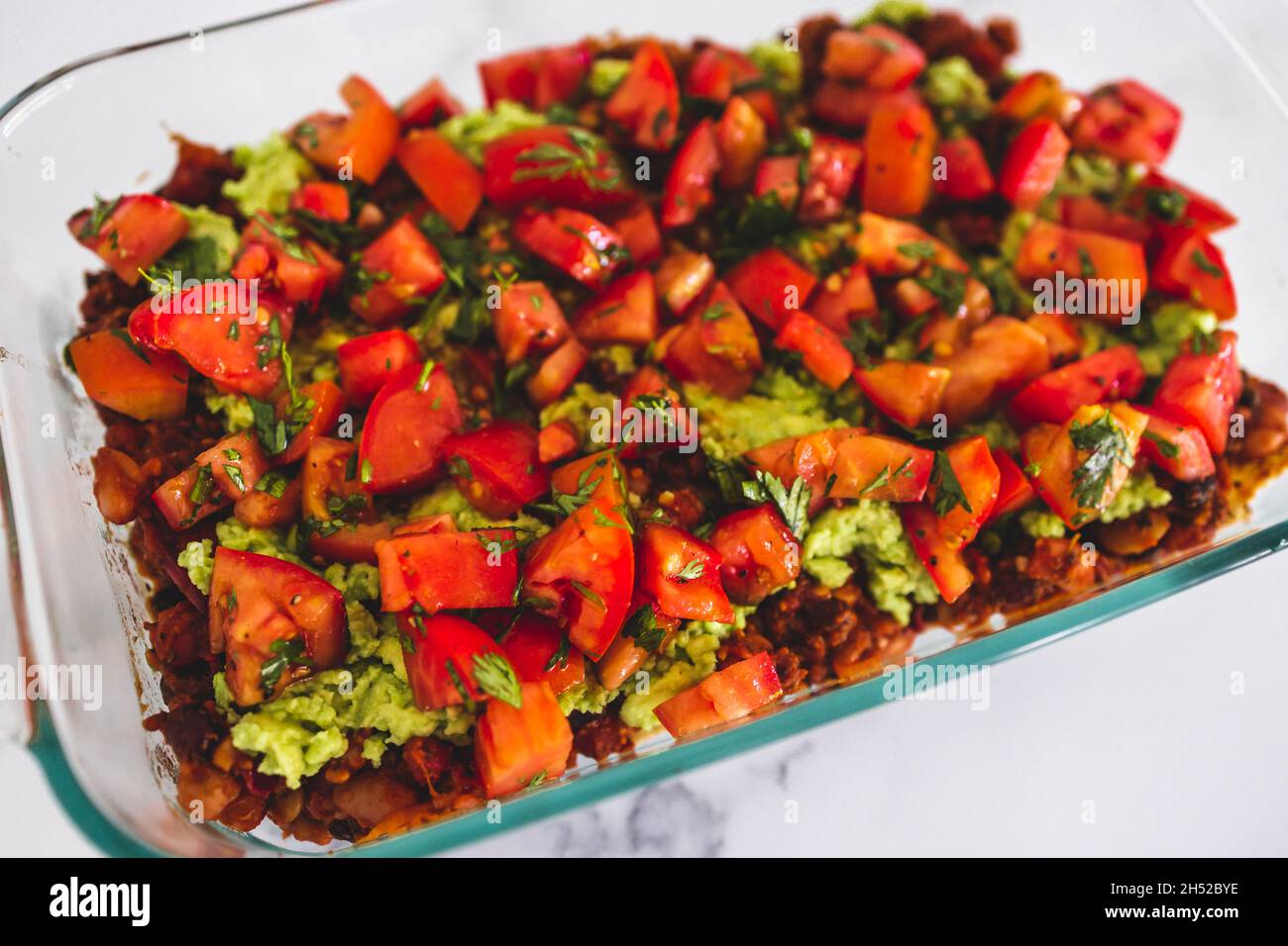vegan nachos with corn chips beans guacamole and fresh tomato salsa ...
