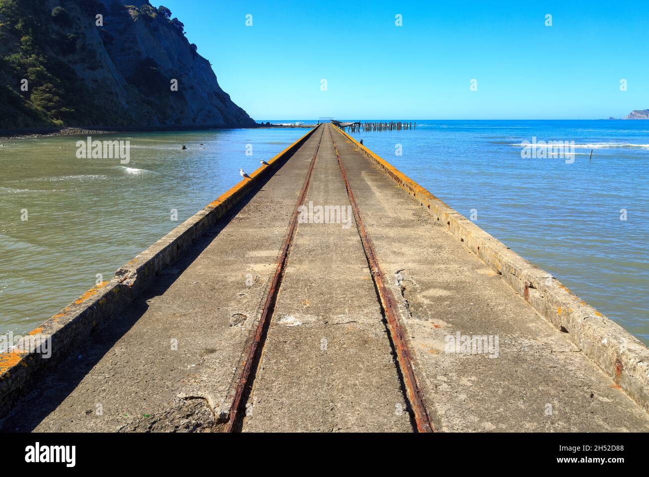 The historic concrete wharf at Tokomaru Bay, New Zealand (built 1940 ...