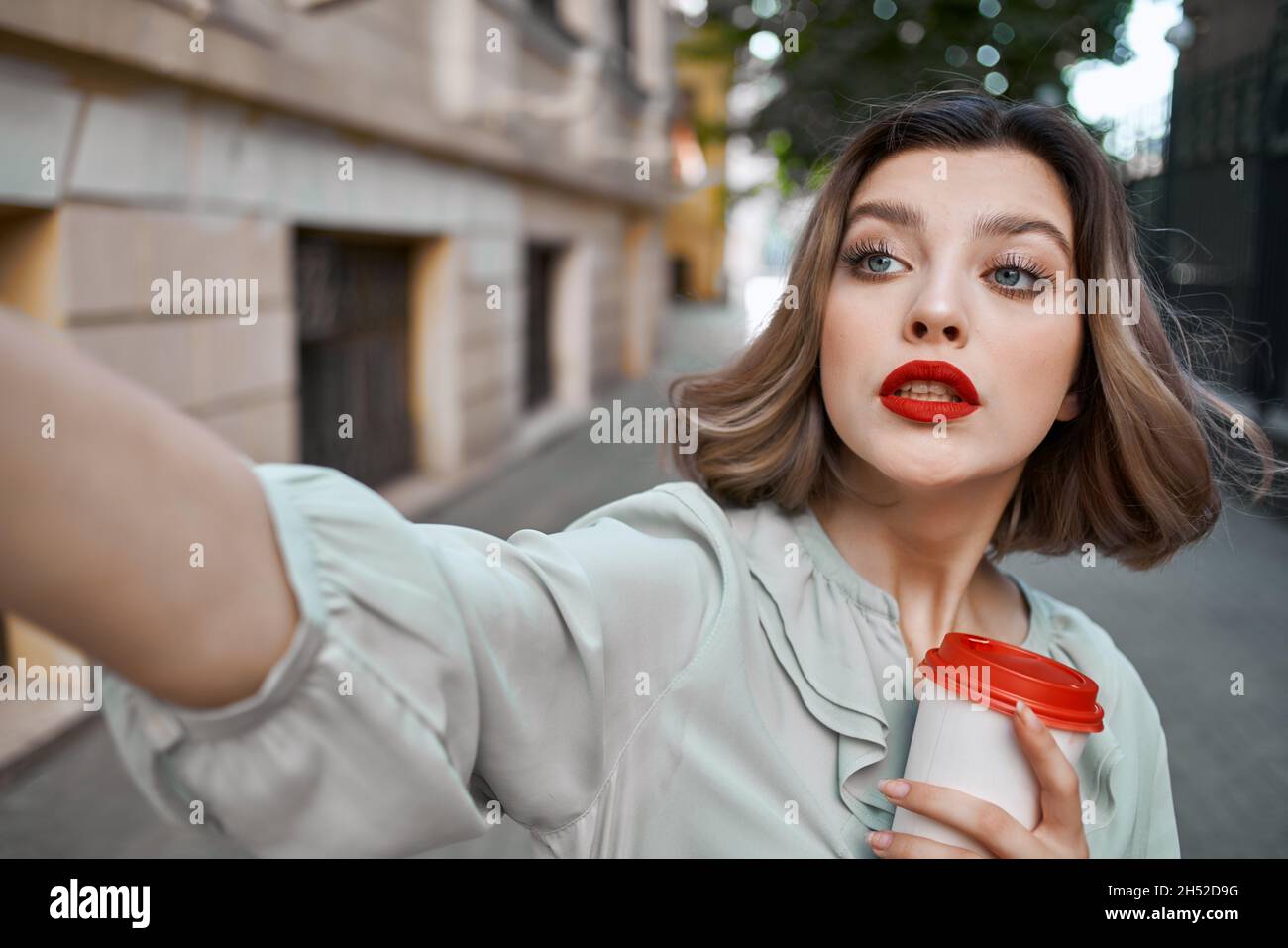 cheerful woman attractive look red lips walk in the park Fresh air ...