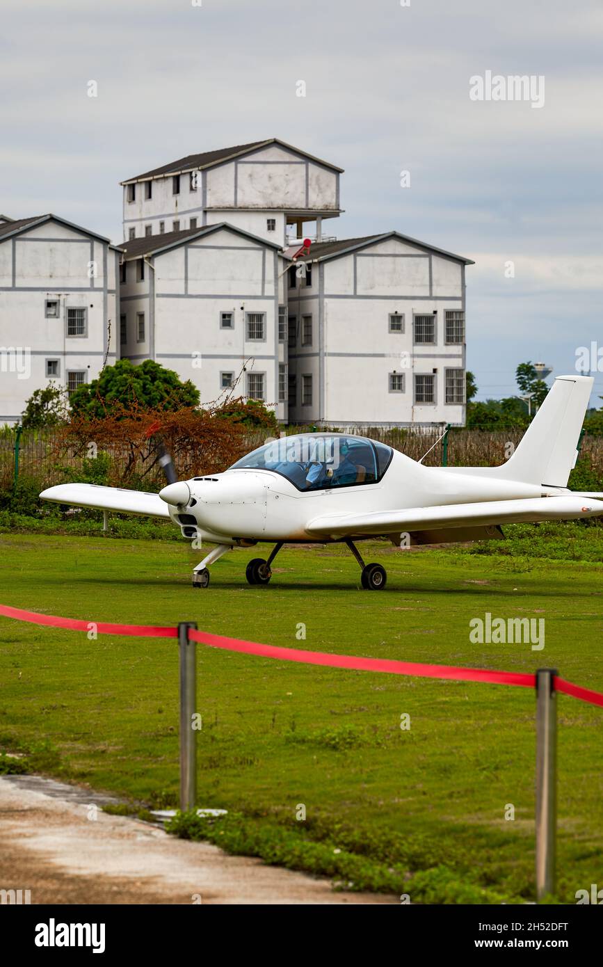 A small plane on the runway of a civil airport prepares to take off ...