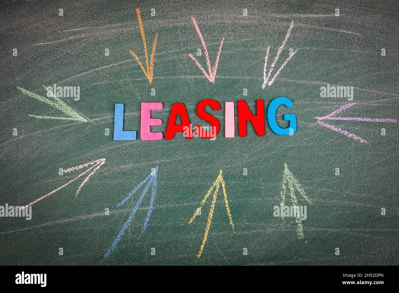 Leasing concept. Word from the letters of the wooden alphabet on the ...