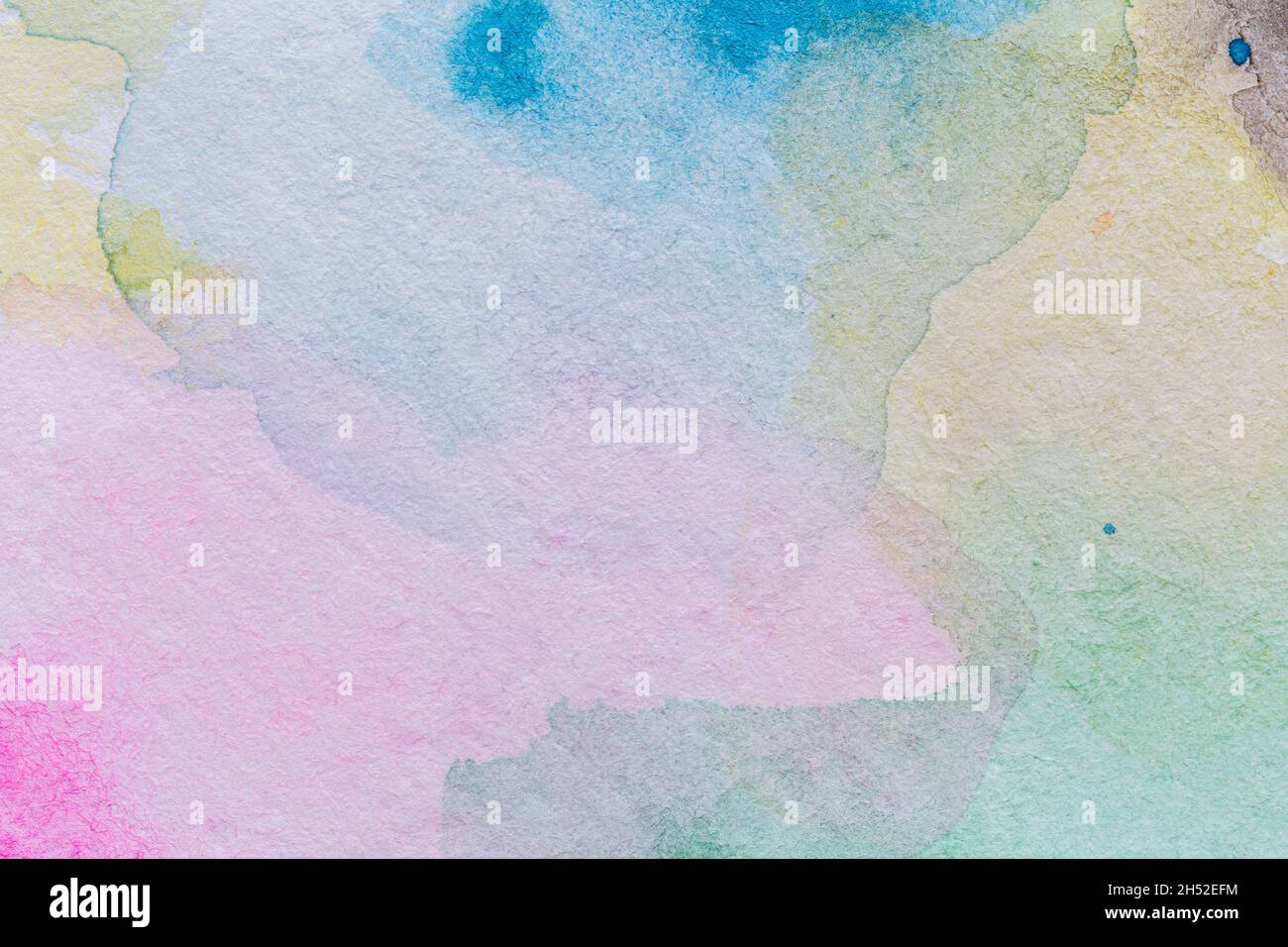 Macro close-up of an abstract multicolored yet pale watercolor gradient ...