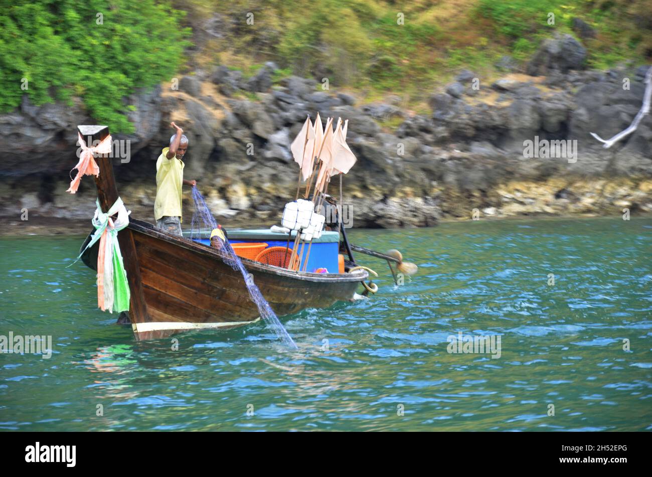 Thai old man fisher people sailing wooden long tail boat fishery use ...