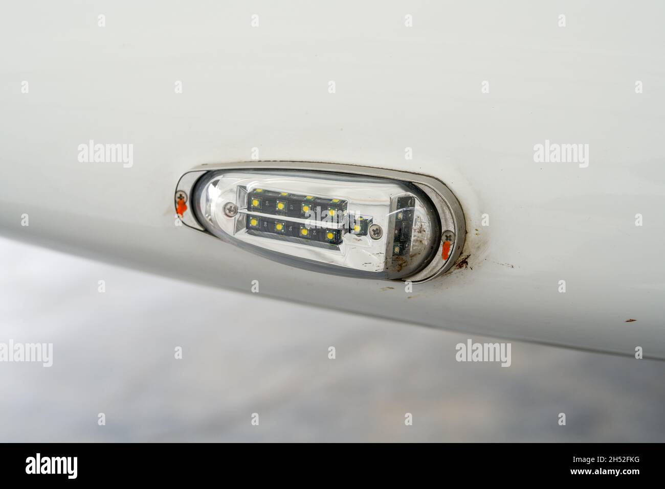 A close-up of the width indicator lights on the wing of a small ...