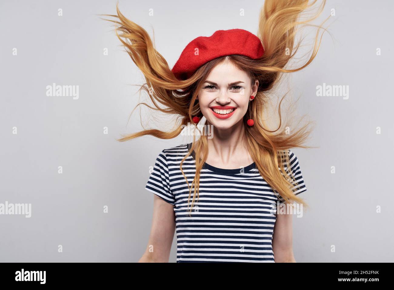 beautiful woman wearing a red hat makeup France Europe fashion posing ...