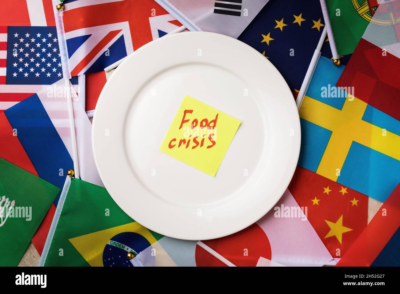 Sticker with text in a white plate on the background of the flags of ...