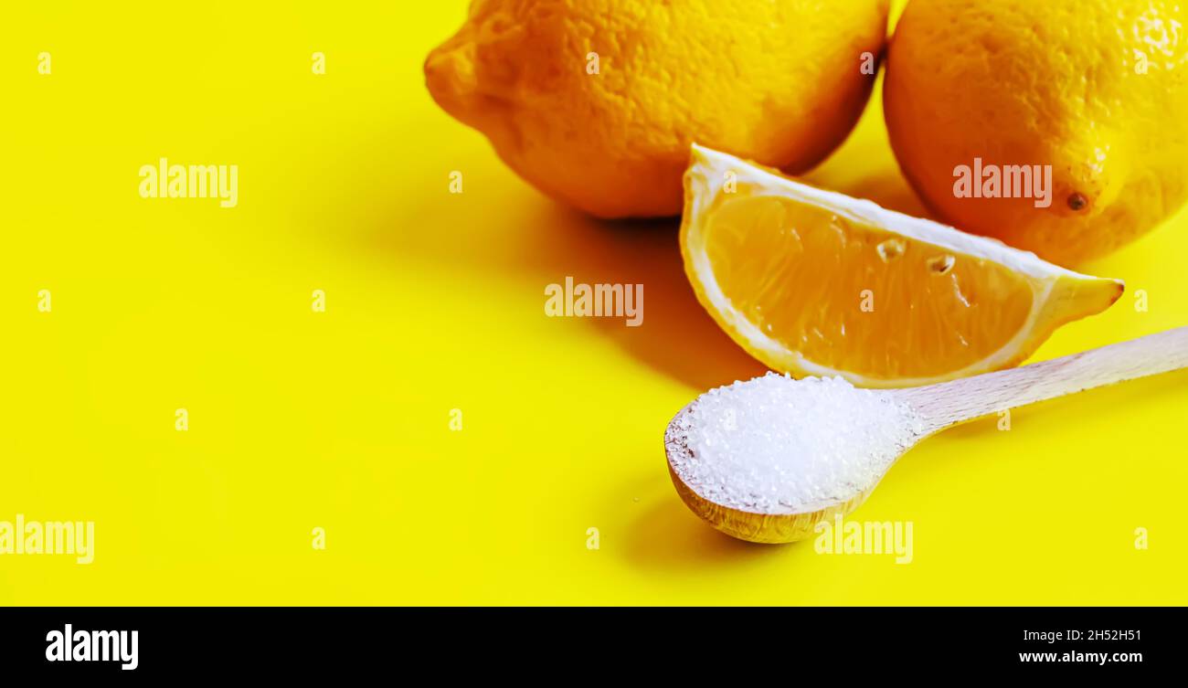 Citric acid on a yellow background. Selective focus.nature Stock Photo ...