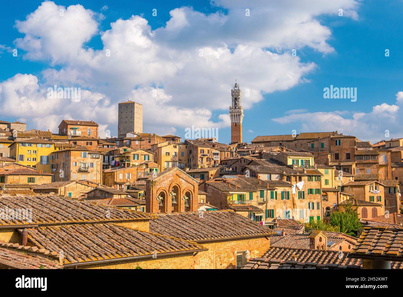 Downtown Siena skyline in Italy with blue sky Stock Photo - Alamy