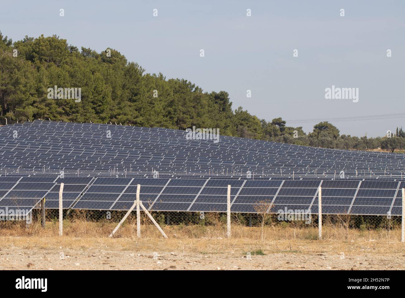 Low angle wide shot of big solar systems collecting energy from sun ...