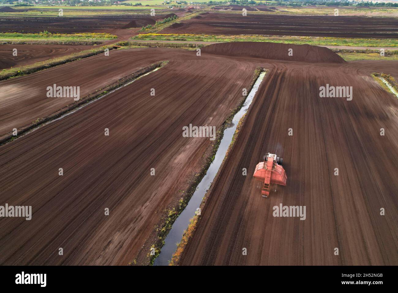 Peat Harvester Tractor on Collecting Extracting Peat. Mining and ...