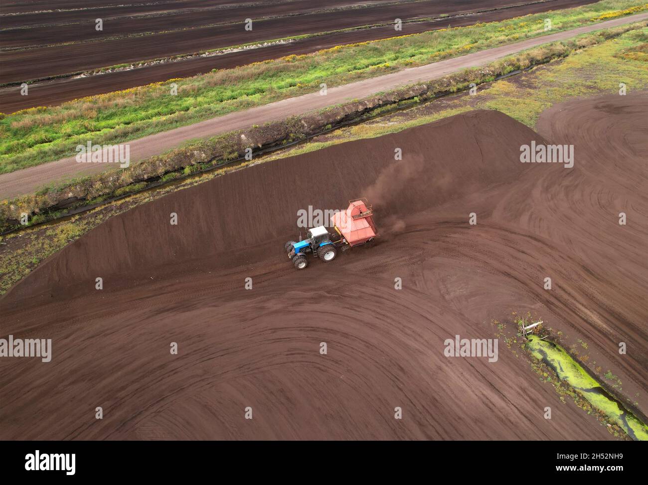 Peat Harvester Tractor on Collecting Extracting Peat. Mining and ...