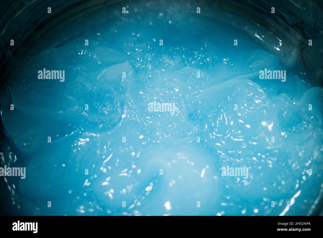 Liquid gel at mixer. Blue gel for health care products. Medical ...