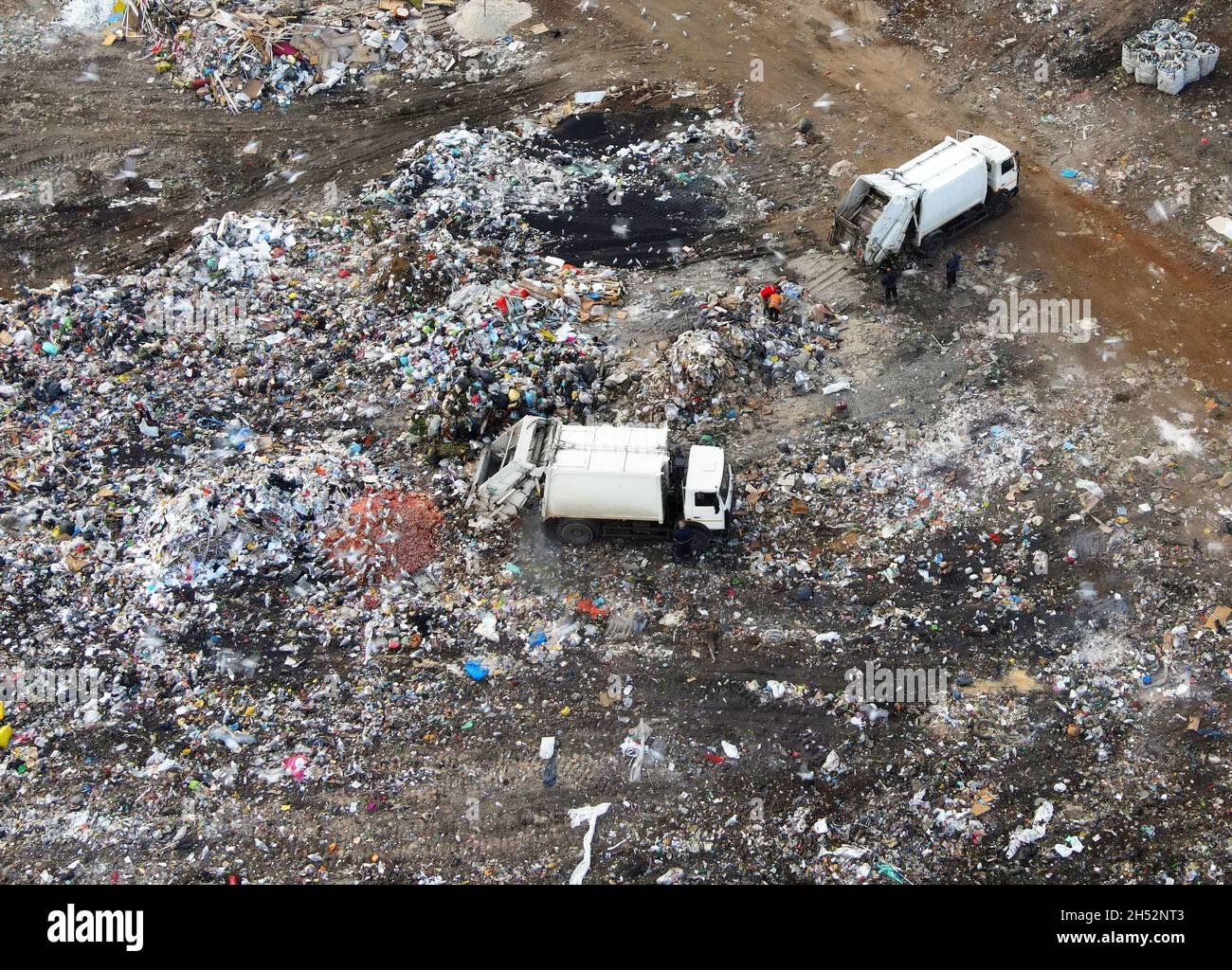 Arial view of garbage truck during unloading the rubbish and food waste ...