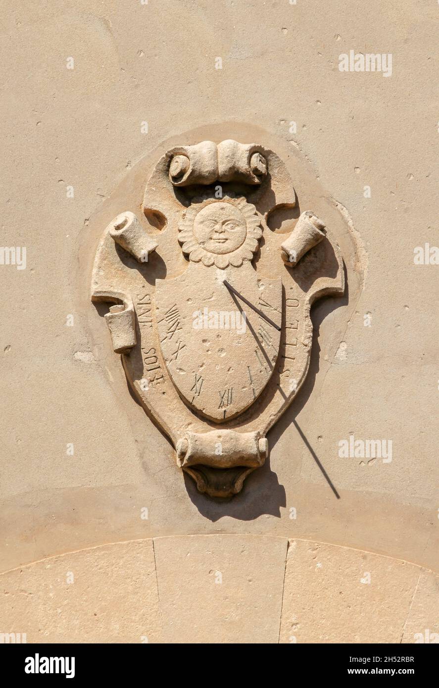 A medieval sundial on an old house facade on the Spanish island ...