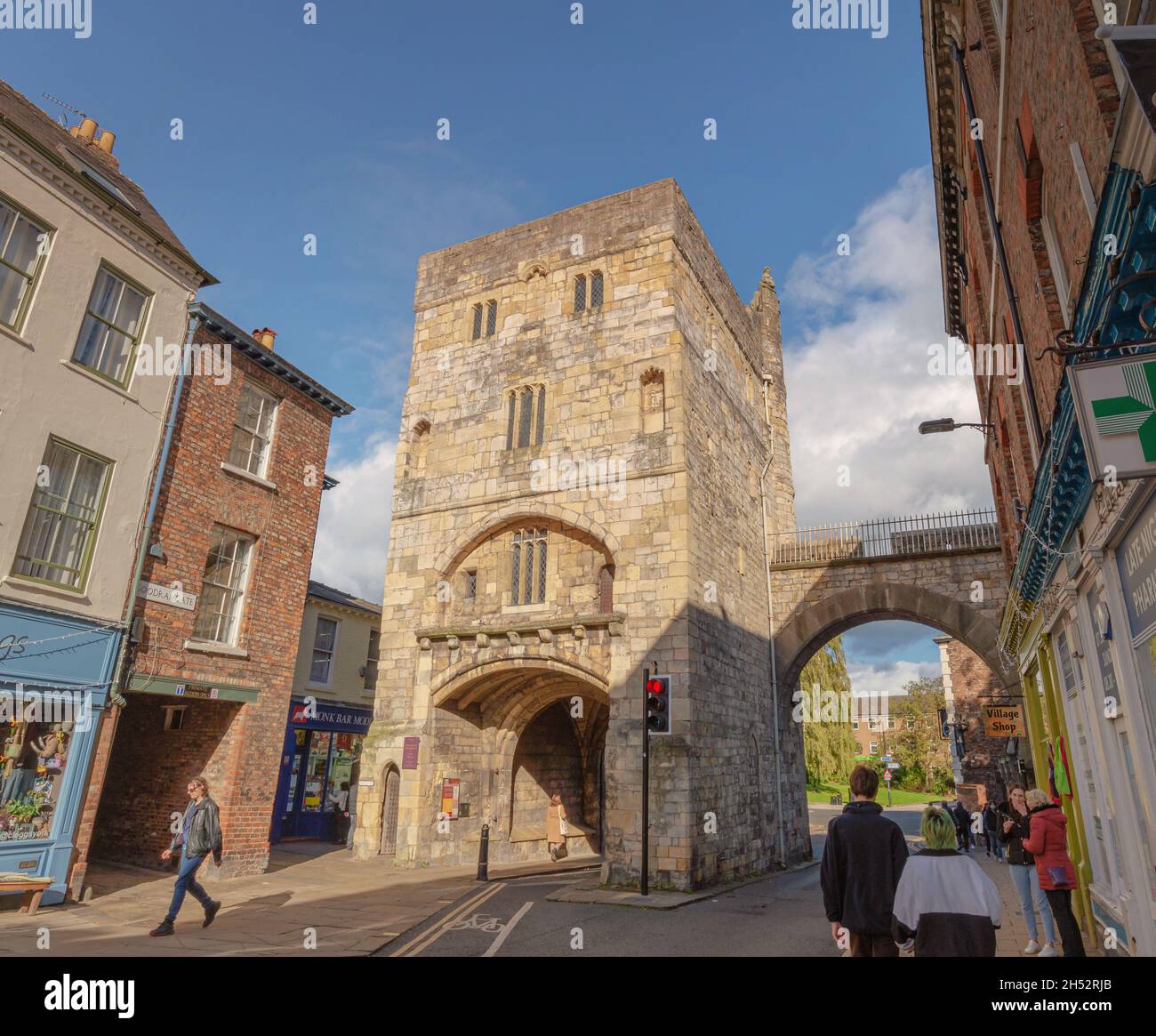 Historic city gateway with an arch and a city wall in the sunshine ...