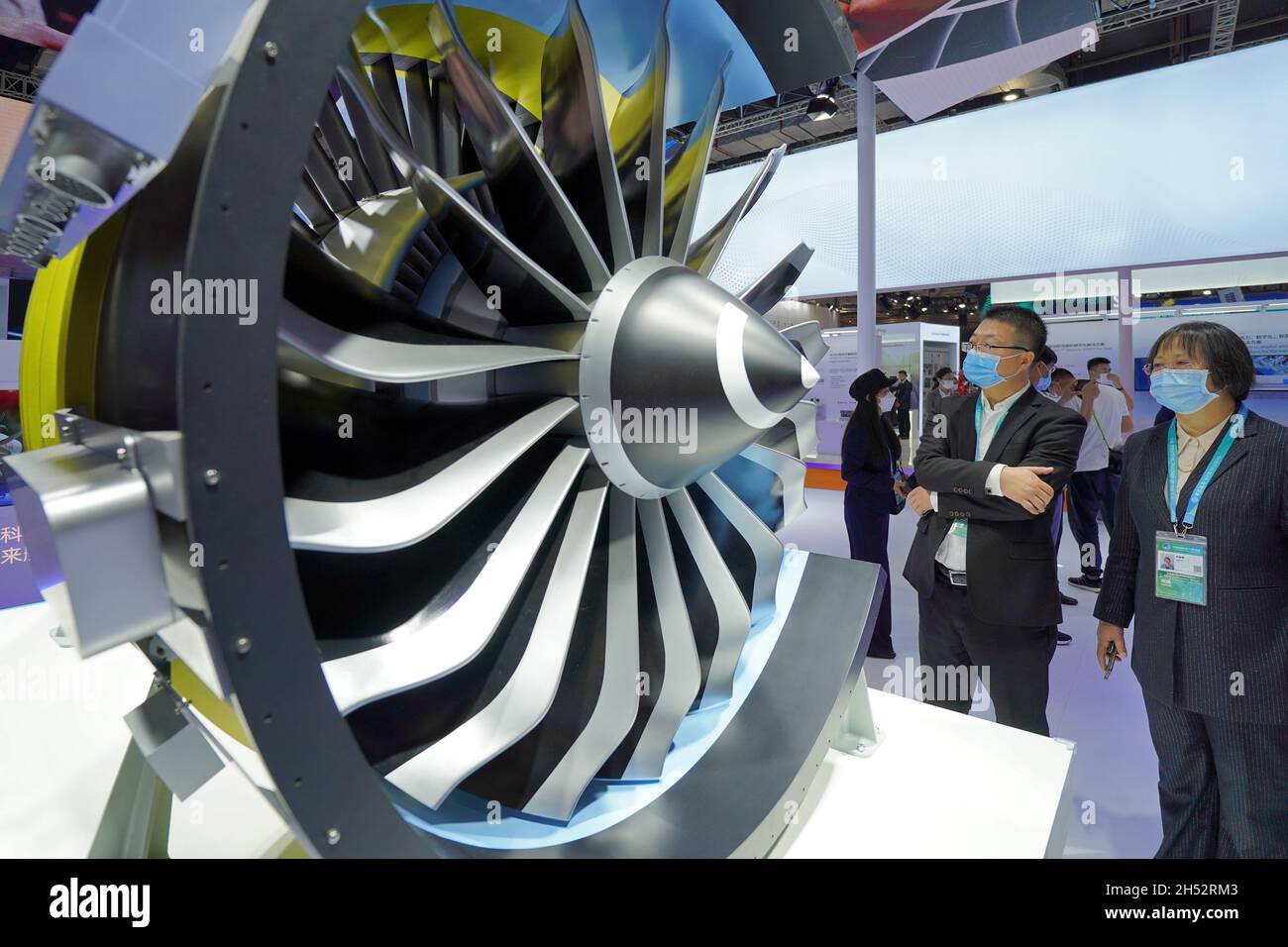 SHANGHAI, CHINA - NOVEMBER 6, 2021 - Visitors look at a LEAP engine ...
