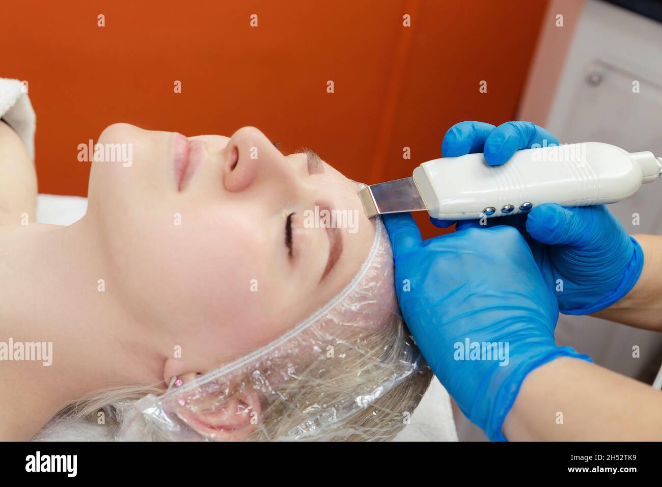 Ultrasonic cavitation procedure for cleansing the skin of a young woman ...
