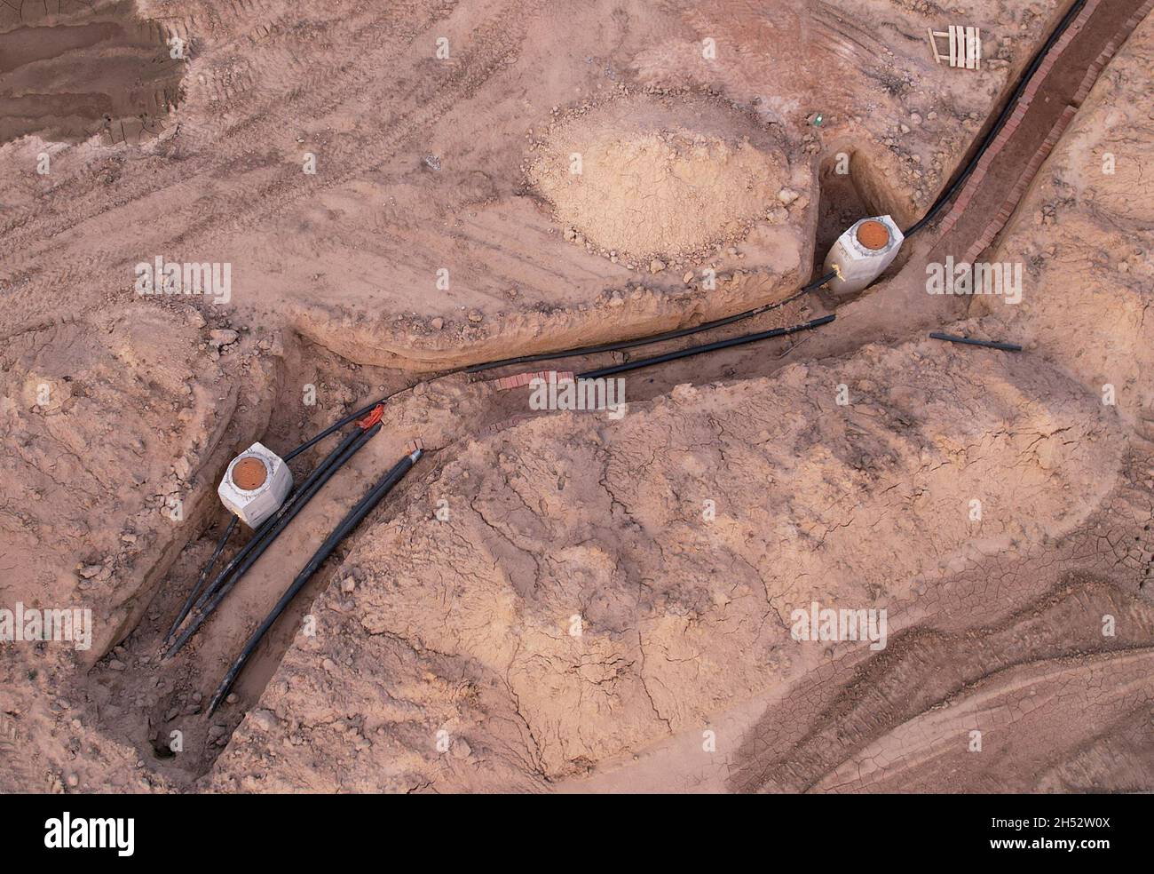 Laying of underground storm sewer pipes and sewerage wells ...