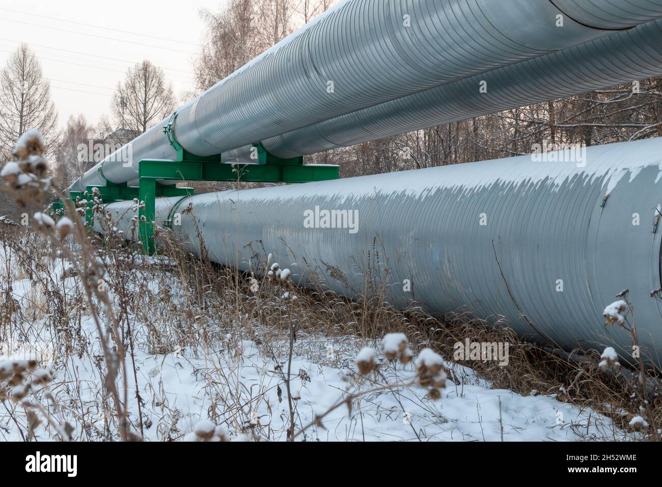 central heating pipes in a protective metal thermal insulation jacket ...