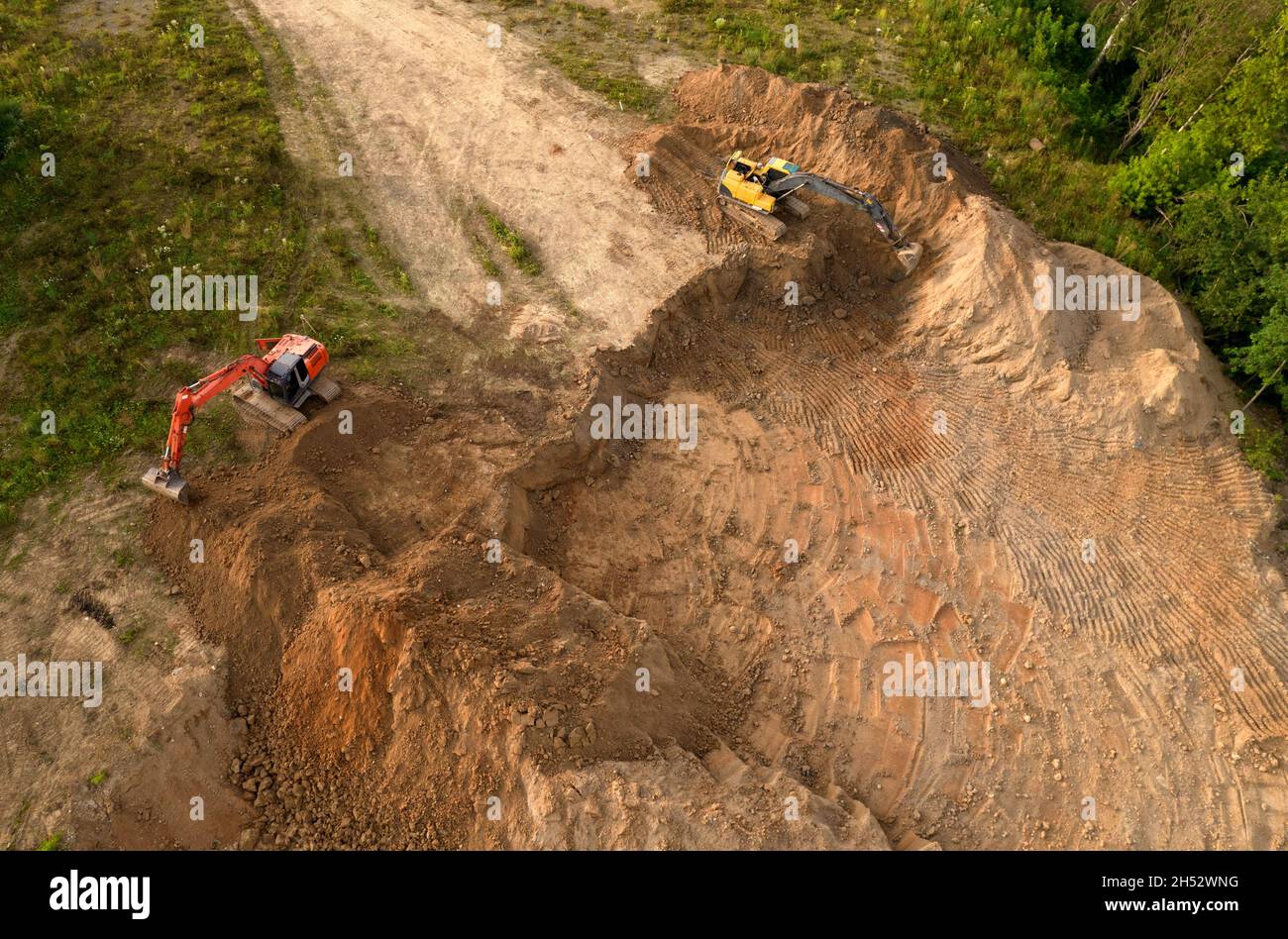 Excavator dig ground at a construction site. Trench for laying external ...